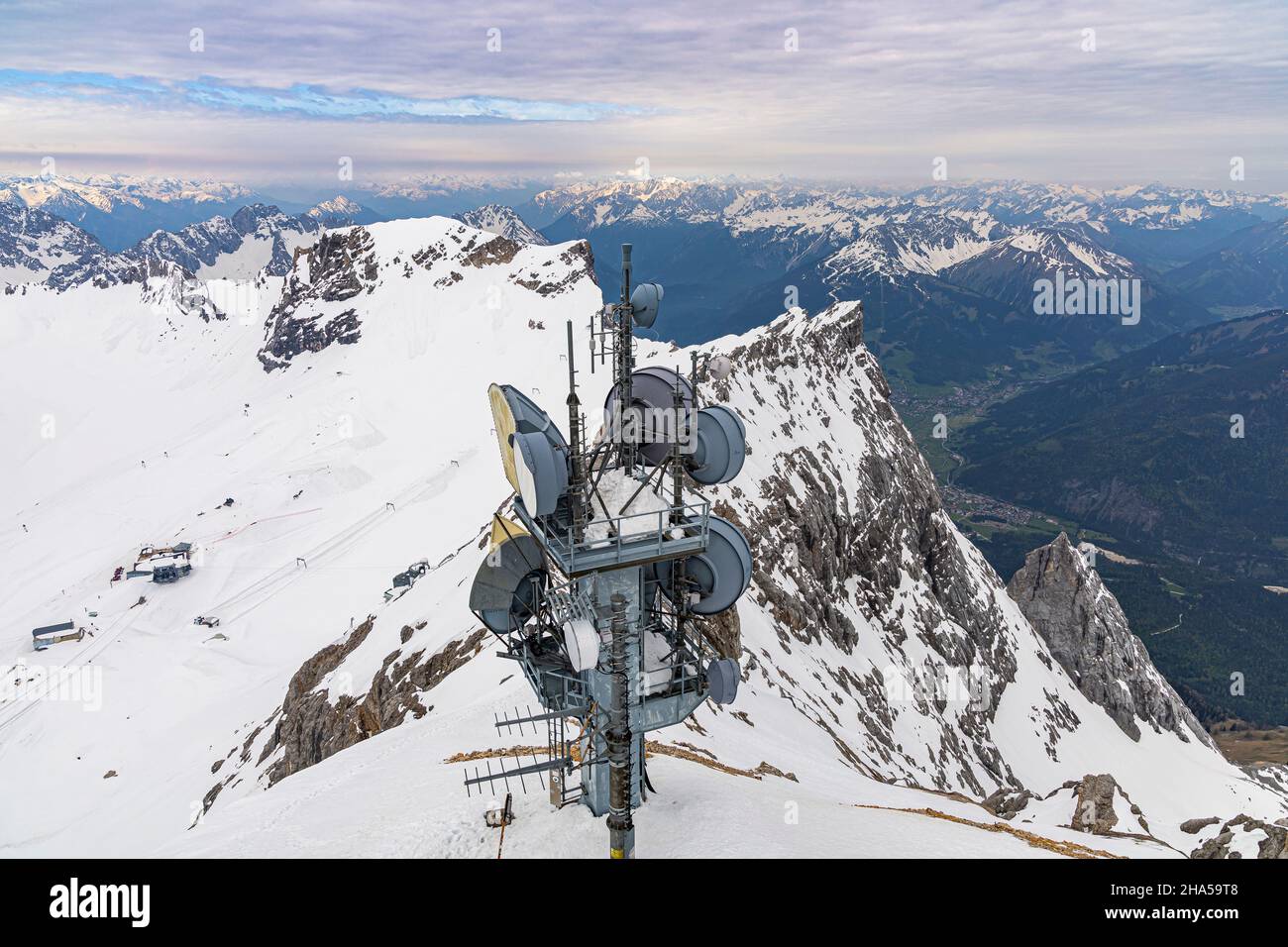 View from Zugspitze summit to surrounding snow-covered mountain ...