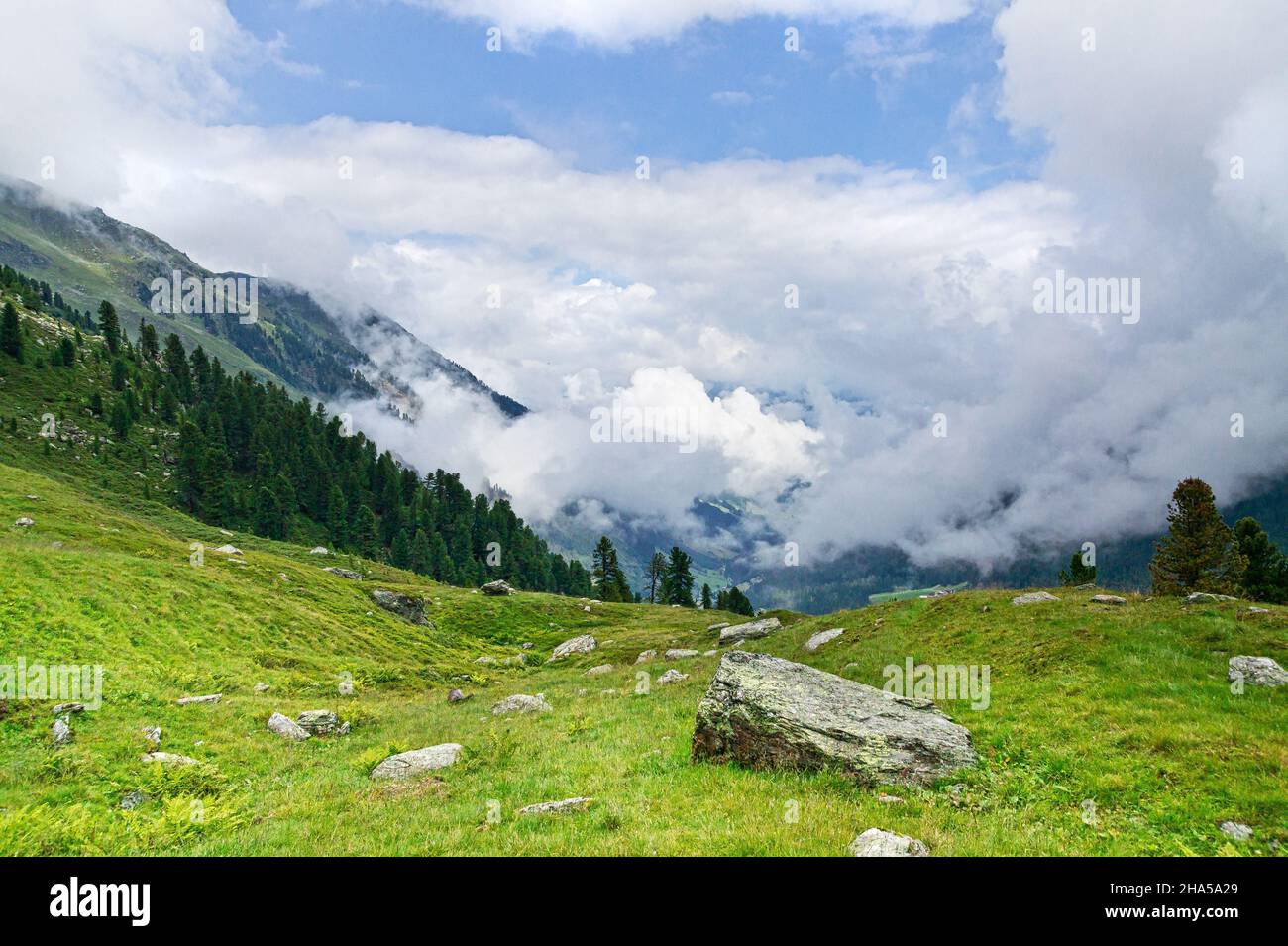 Above the clouds in the high mountains between the peaks Stock Photo ...