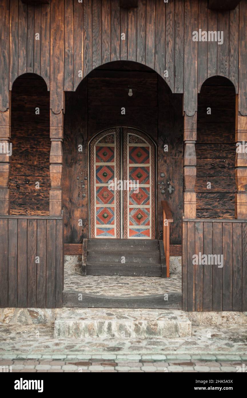 Detail view of old massive huge church wooden ancient door. Secret ...