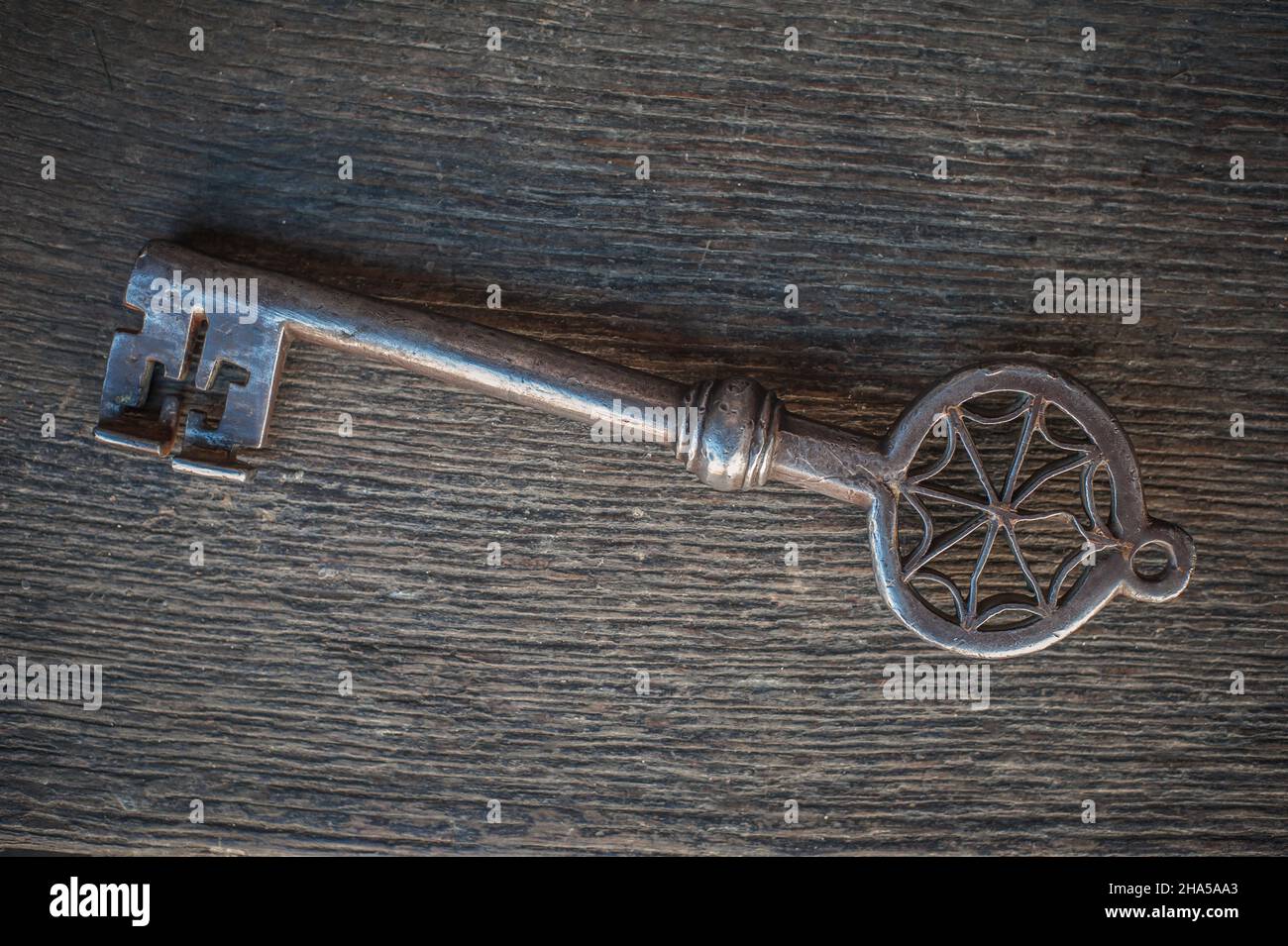 Closeup detail view of old large huge massive metal key for entrance ...