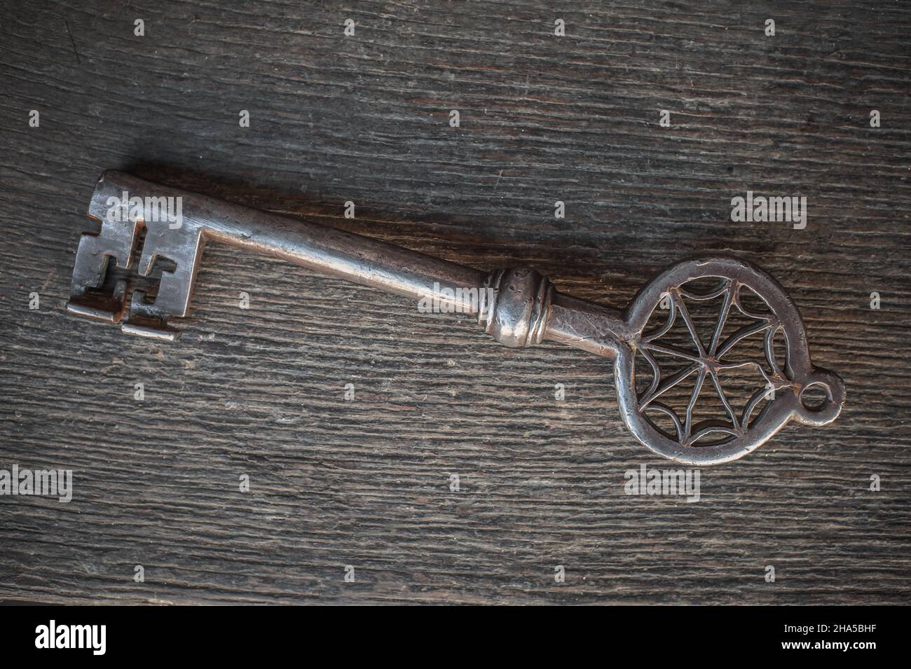 Closeup detail view of old large huge massive metal key for entrance ...