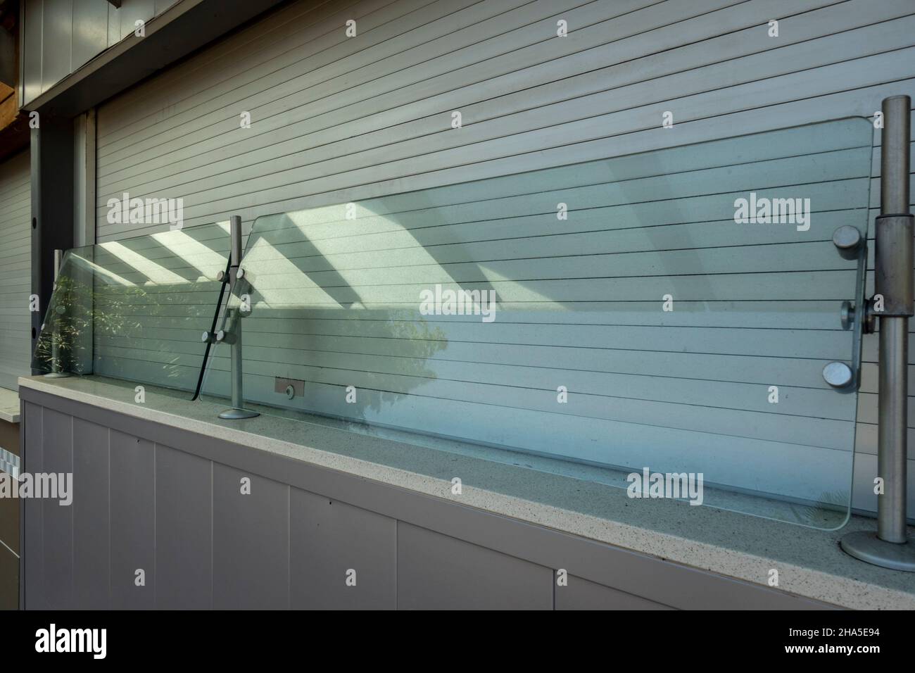 View of a glass sneeze guard protecting customers' food at a closed ...