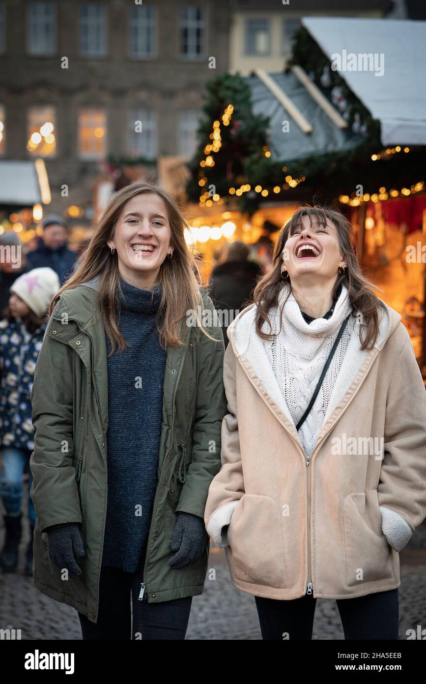 two friends experience the christmas market in bamberg,bavaria,germany ...