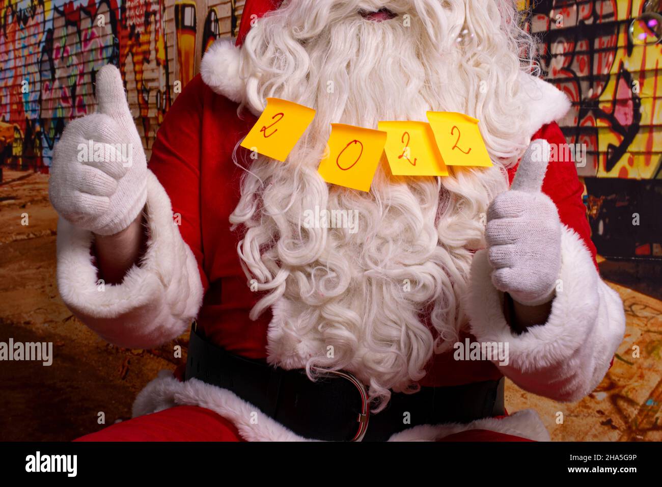 Santa Claus with sticky notes glued to his chin that says 2022 Stock ...