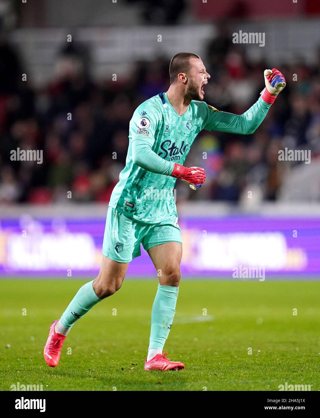 Watford goalkeeper Daniel Bachmann celebrates after team-mate Emmanuel ...
