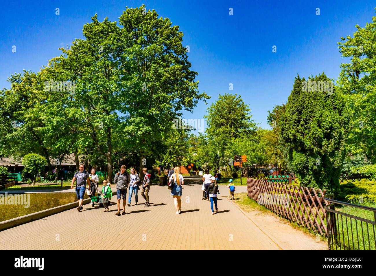 WROCLAW, POLAND - May 06, 2018: People walking on a footpath along ...