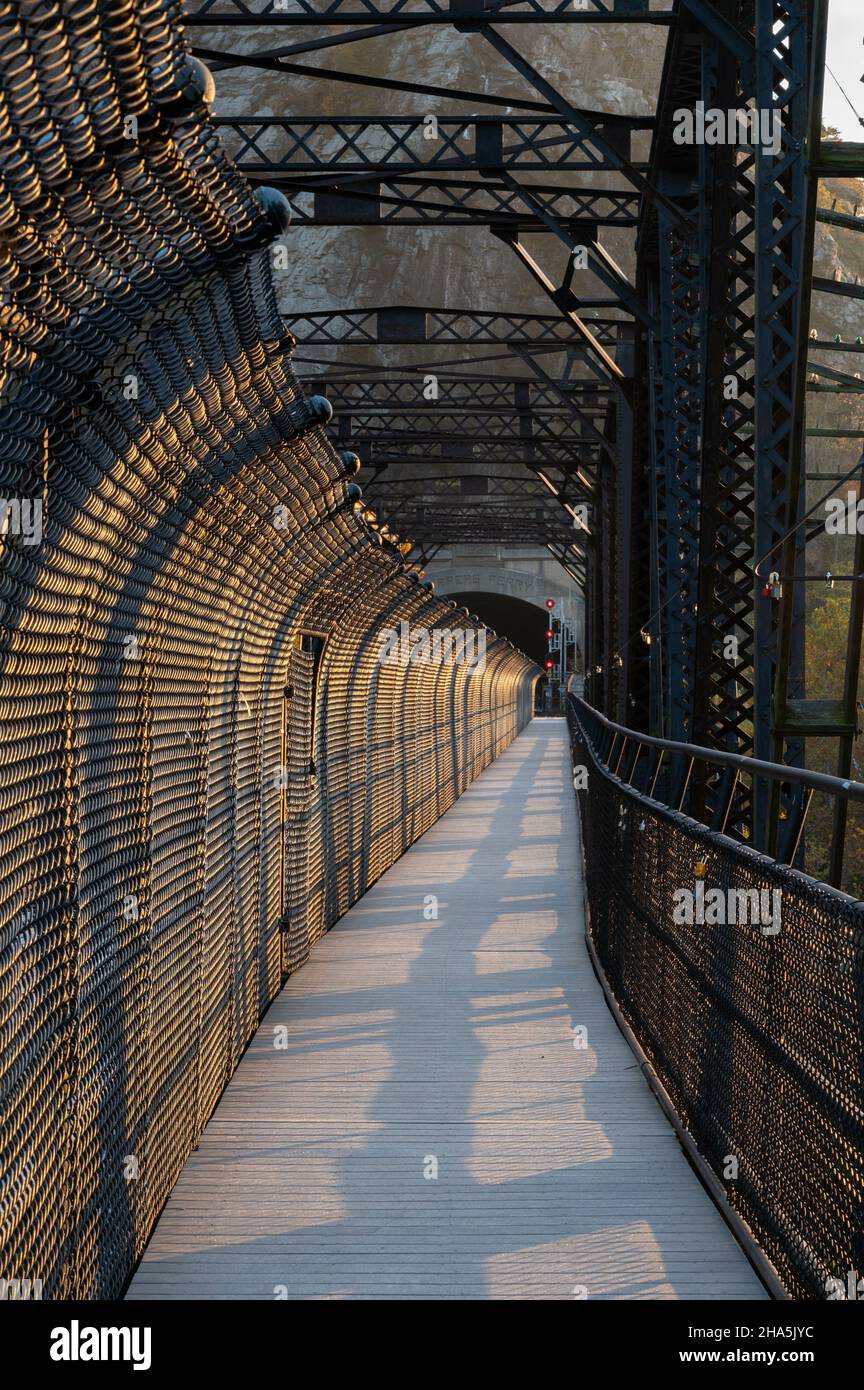 Beautiful view of a black metal bridge with a net pattern Stock Photo ...