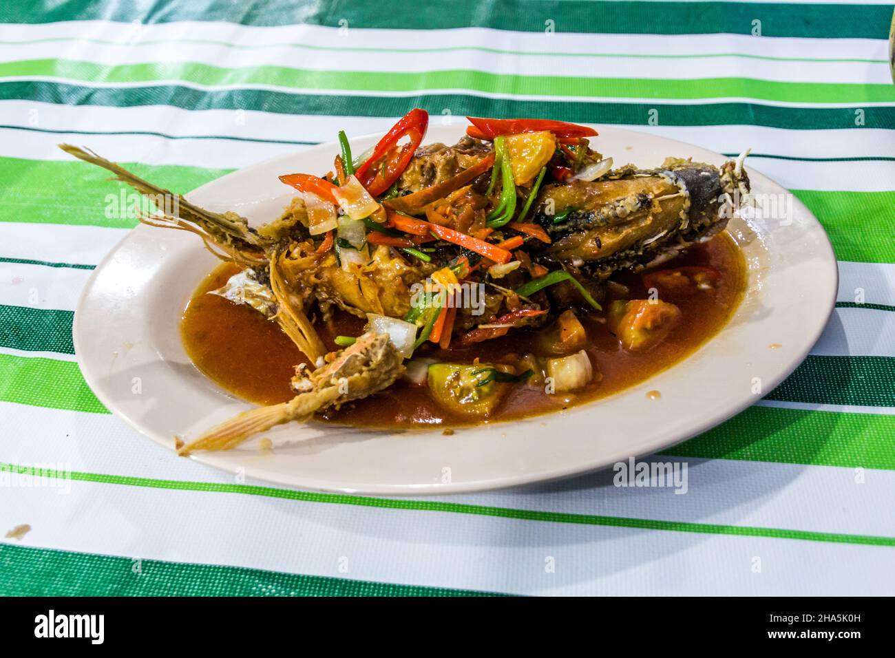 Fish dish at a seafood restaurant at the night market in Kota Kinabalu ...