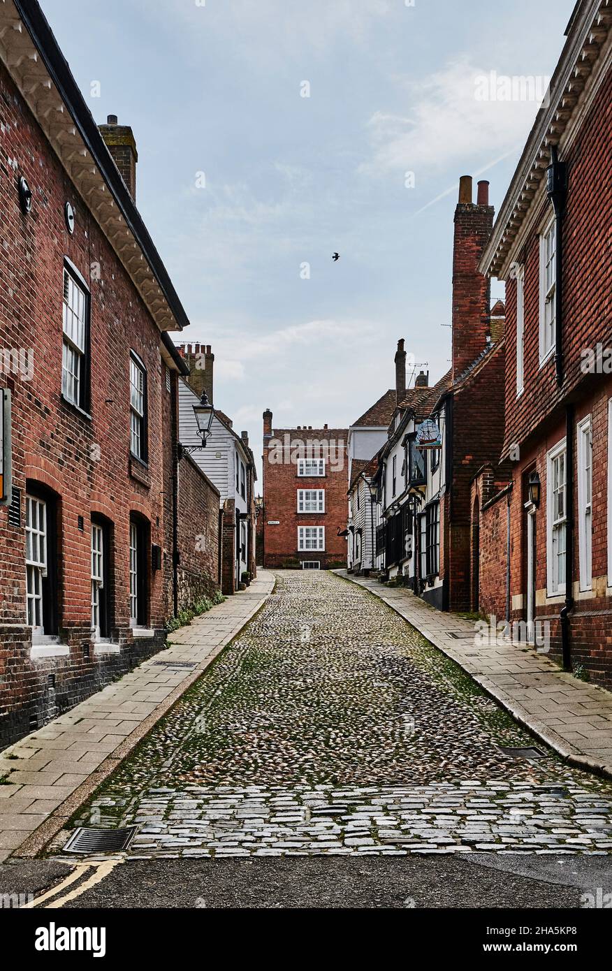 A streetscape of a laneway with residences and shops in Rye, East ...