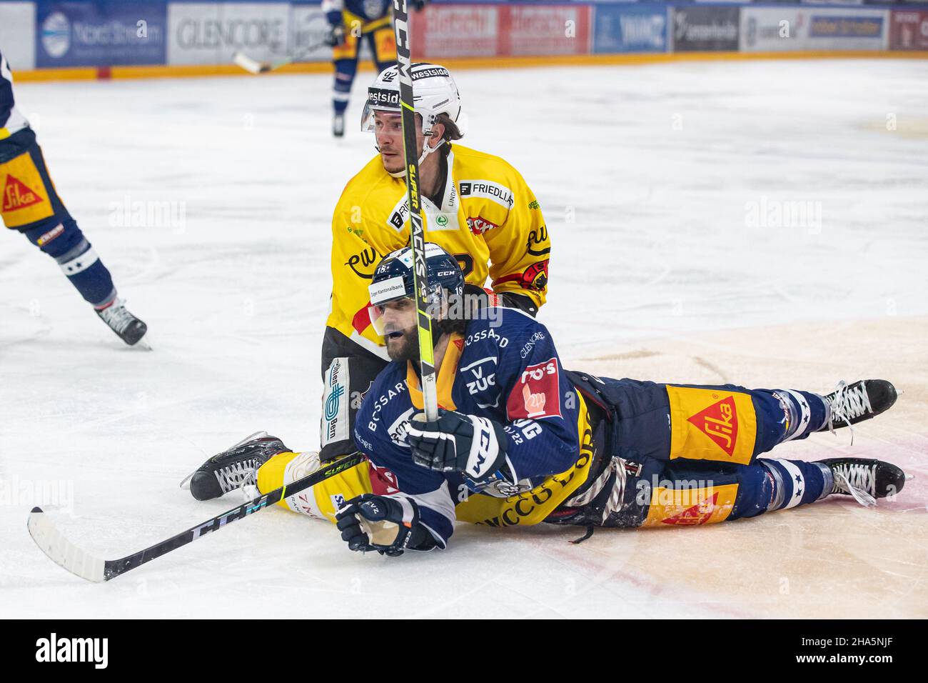 # 92 Christian Thomas (Bern) and Dominik Schlumpf # 18 (EV Zug) during ...