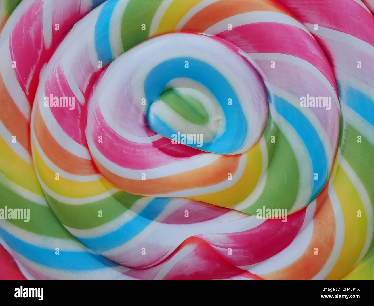 Sweet colourful lollipop background in pink, blue. yellow and green ...