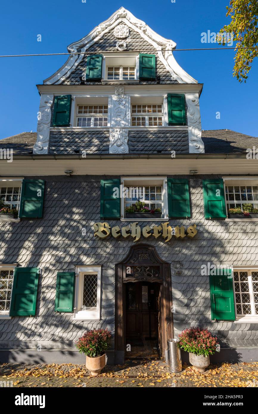 Half timbered house with slate cladding and green shutters hi-res stock ...