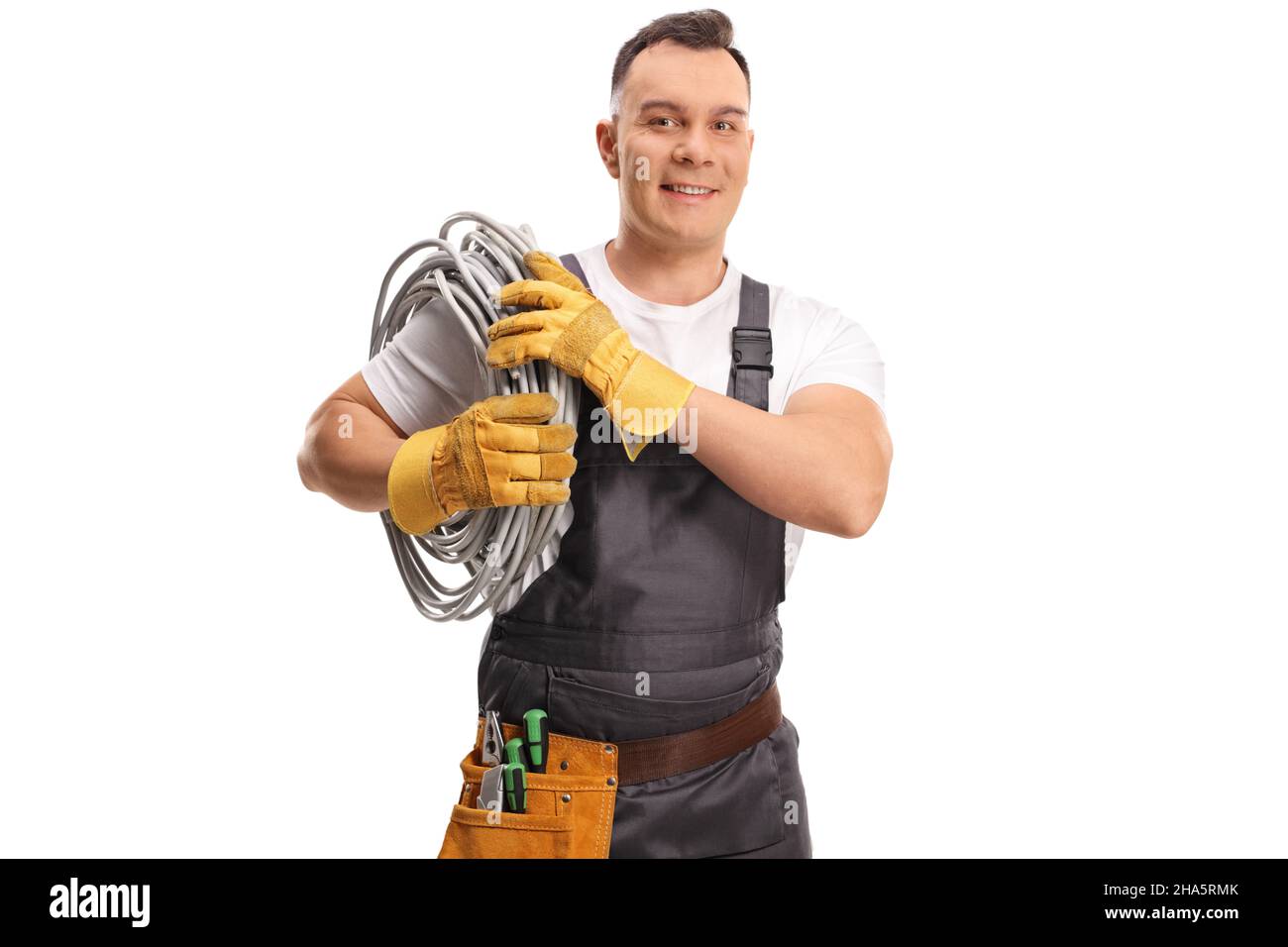 Electrician carrying cables on his shoulder isolated on white ...