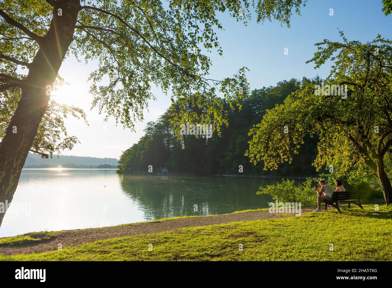 kochel am see,kochelsee (lake kochel),couple at bench in upper bavaria,bavaria,germany Stock ...