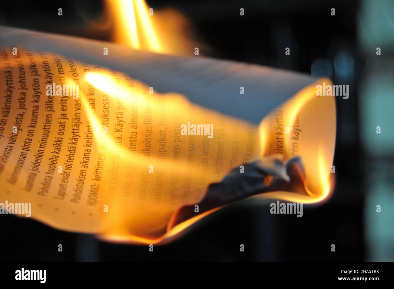 Book page in fire Stock Photo - Alamy