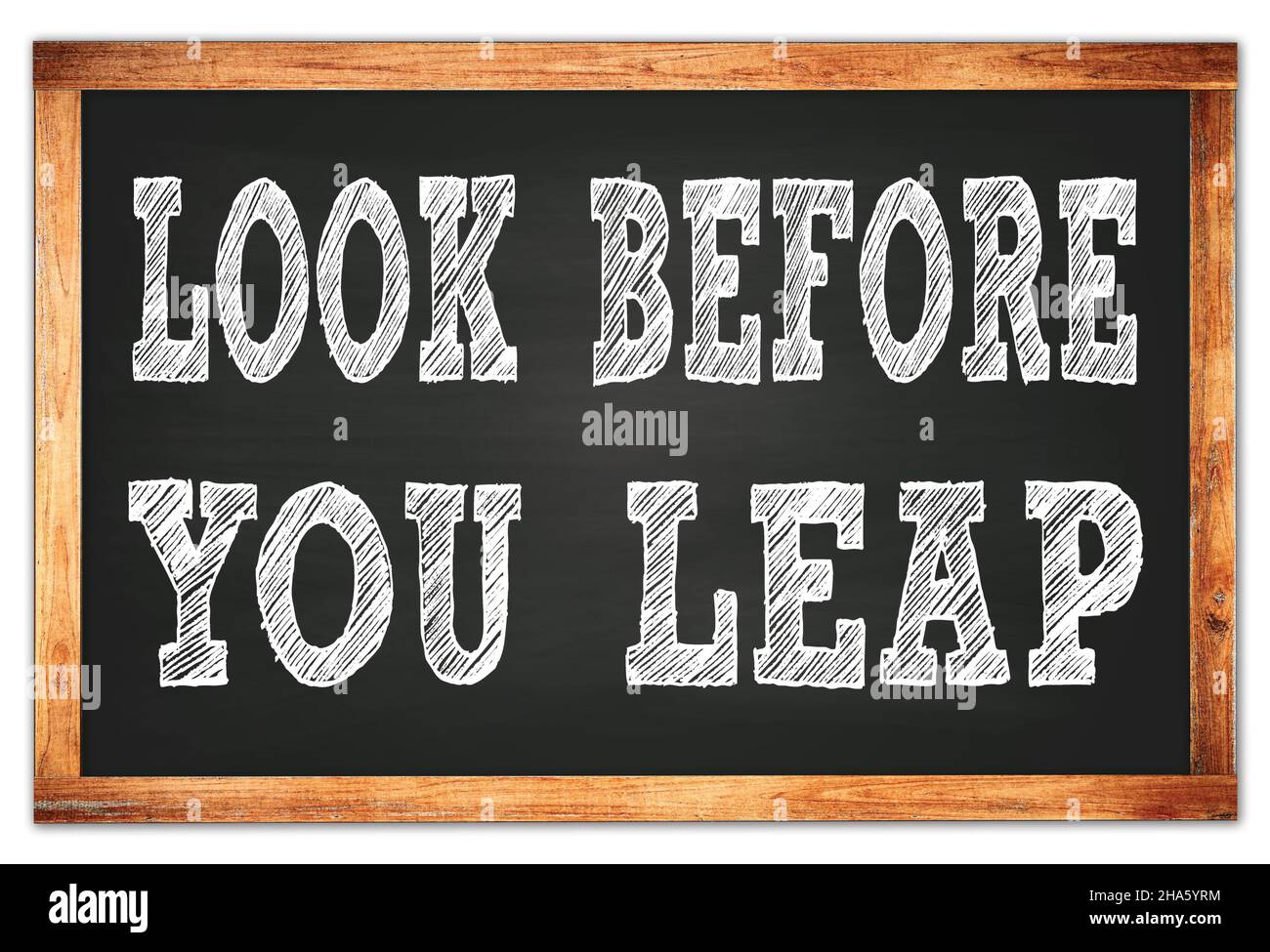 LOOK BEFORE YOU LEAP written on black wooden frame school blackboard ...