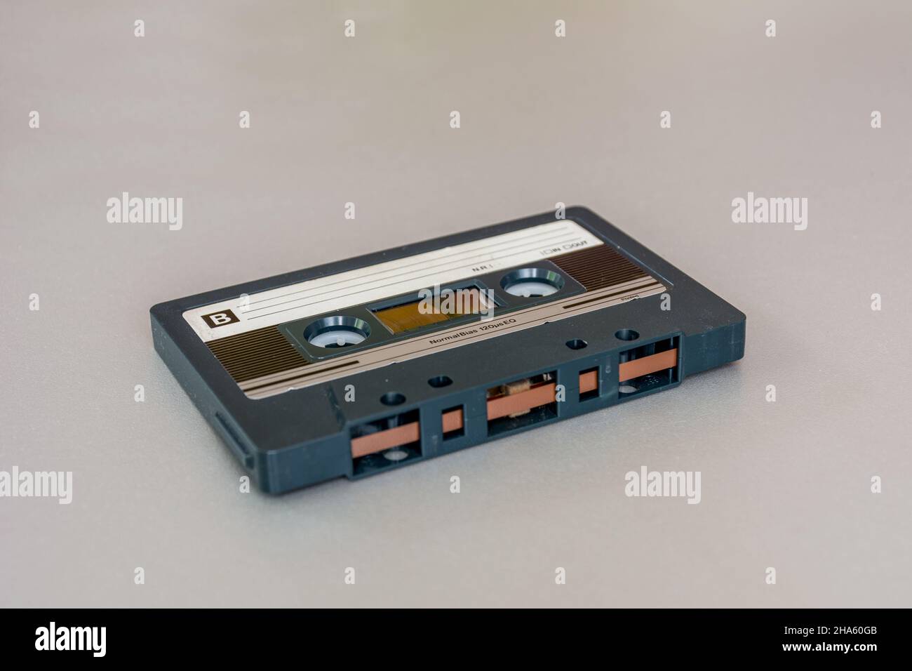 Vintage magnetic cassette tape for audio recording isolated on a white ...