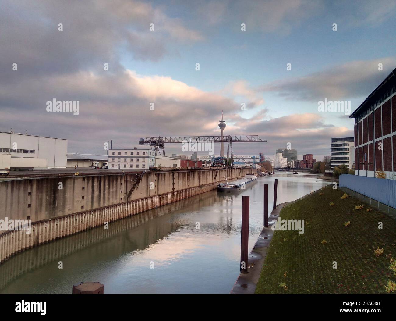 port with cargo ship,modern architecture and television tower Stock ...