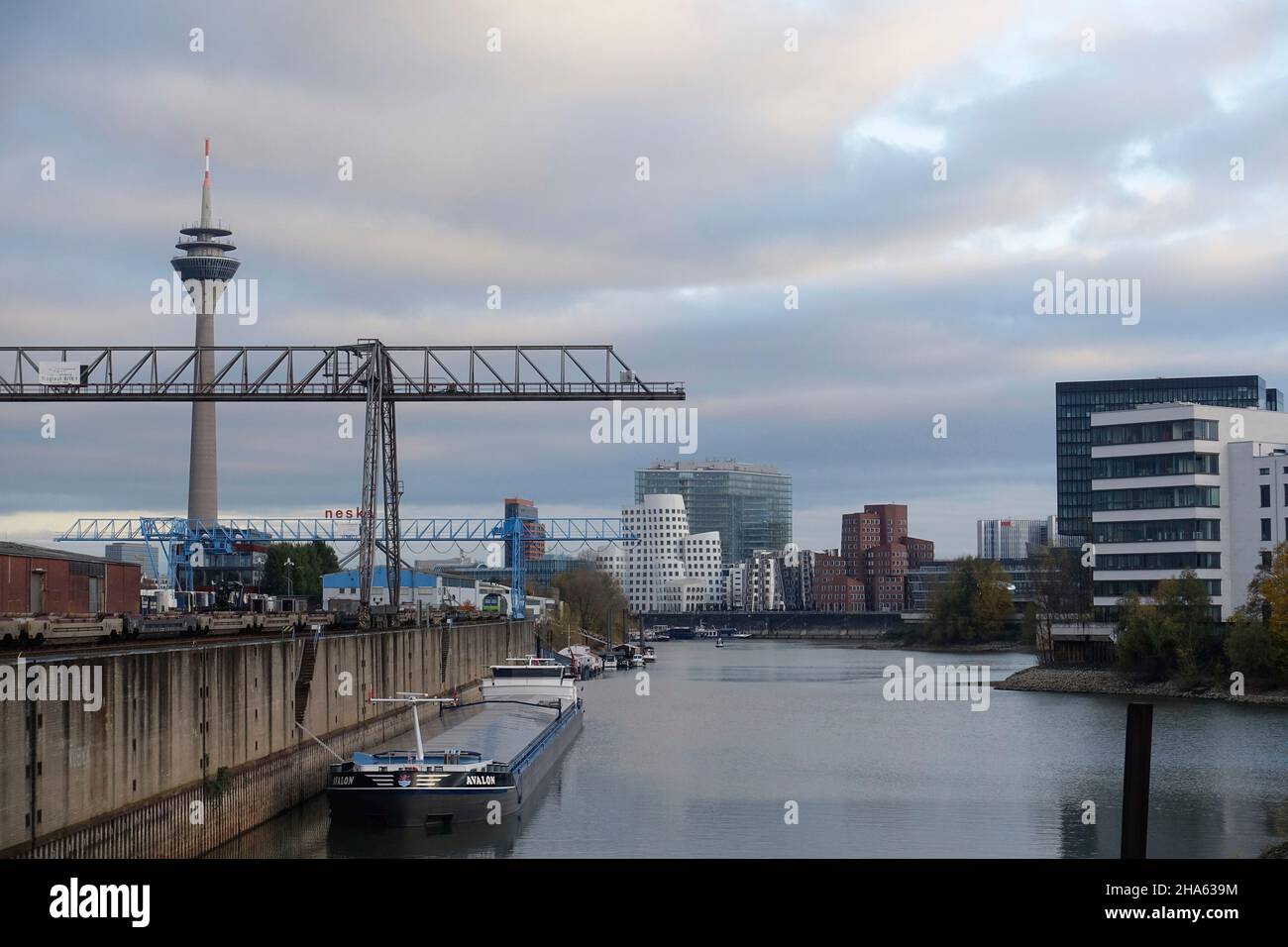port with cargo ship,modern architecture and television tower Stock ...