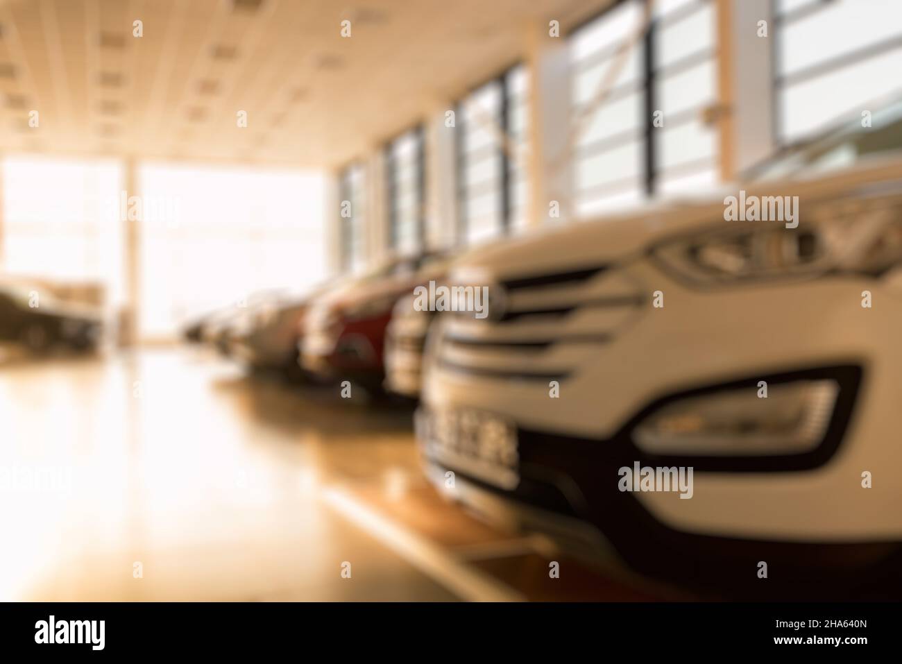 Stock of cars in showroom of automobile dealer with sunlight from ...