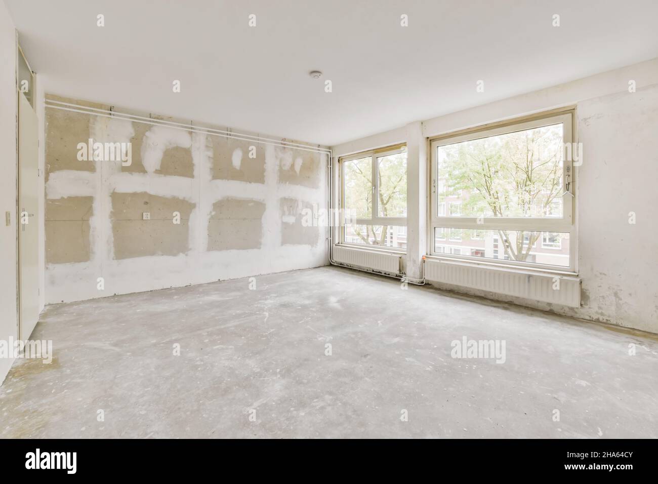 Interior design of a bright room with large windows Stock Photo - Alamy