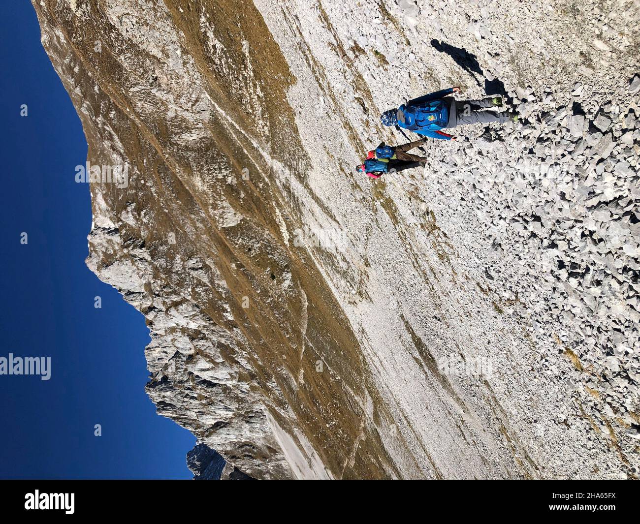 hikers in the scree field on the climb to the frau-hitt-sattel ...