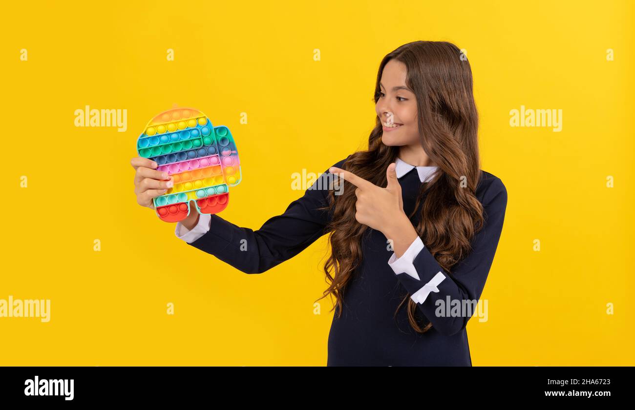 sensory fidgeting. girl with finger game. kid popping anti stress ...