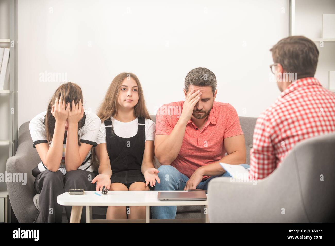 family therapy. parents with kid talk to social worker. mom dad and ...