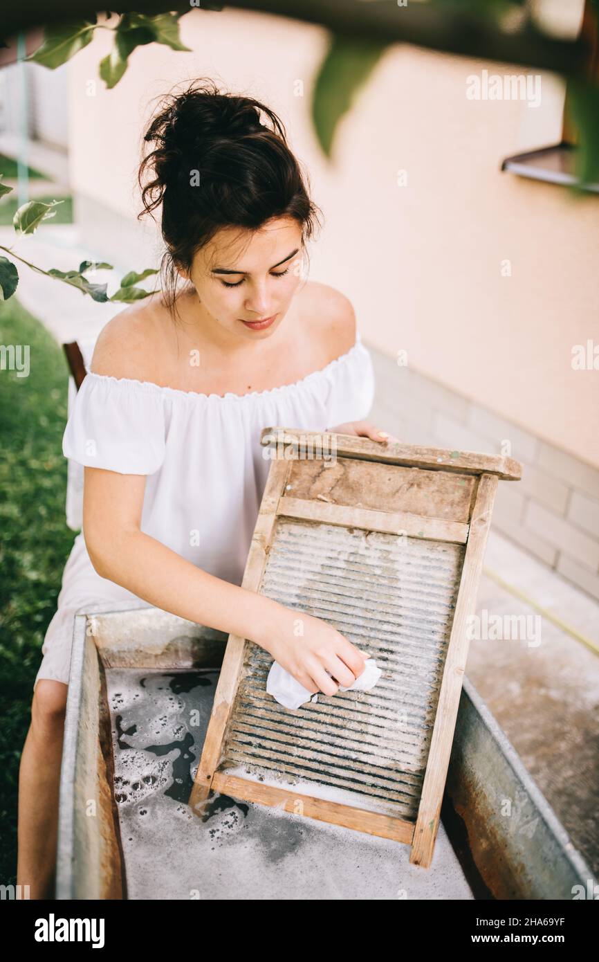 young rural girl doing laundry Stock Photo - Alamy