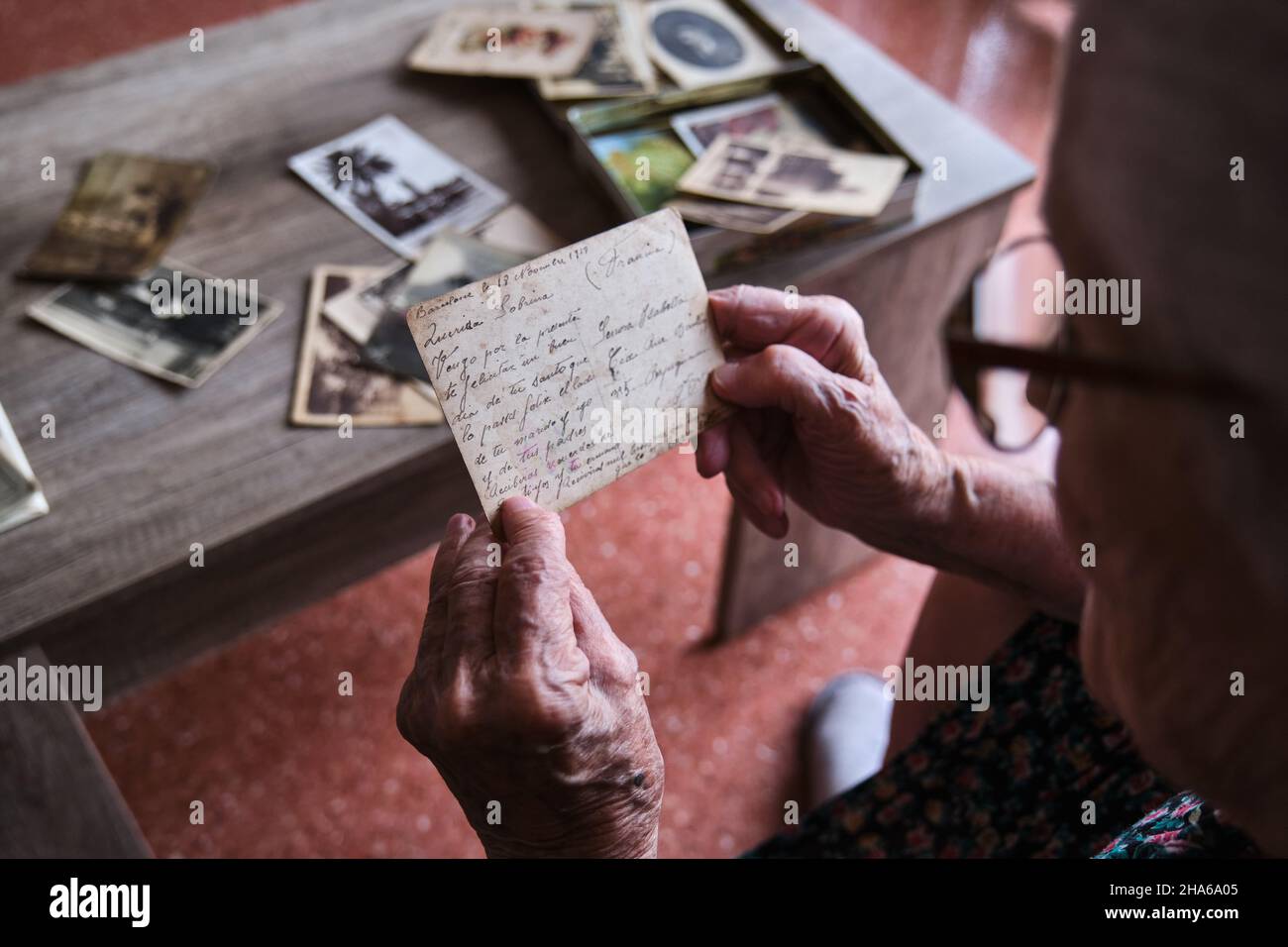 Caucasian elderly woman reading old letters melancholy Stock Photo - Alamy