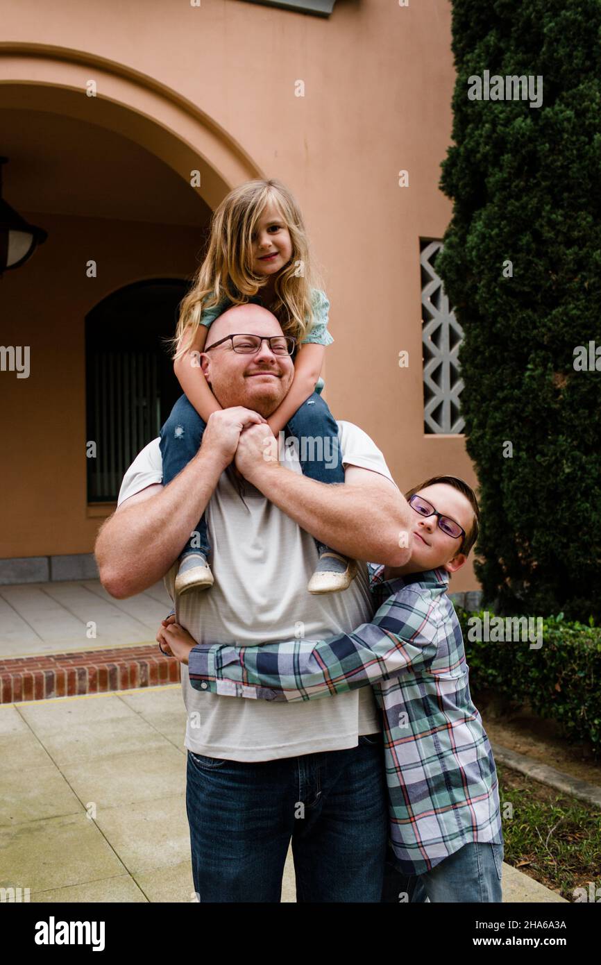 Dad & Kids Posing for Camera at Liberty Station in San Diego Stock ...