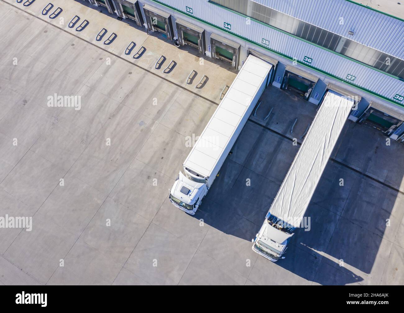 Top view at a Big distribution warehouse with gates for loads and ...
