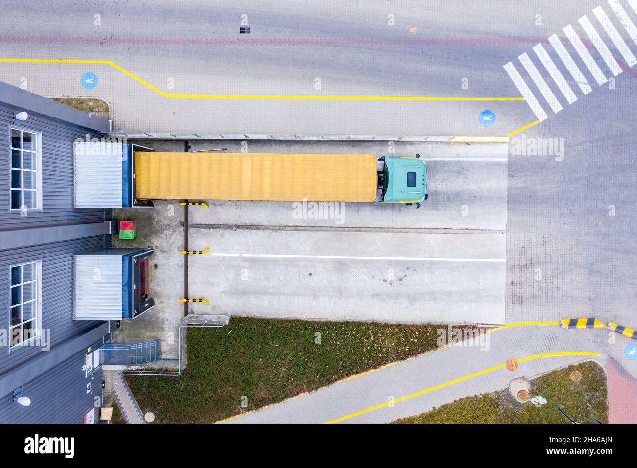 Aerial Side Shot of Industrial Warehouse Loading Dock where Man Stock ...