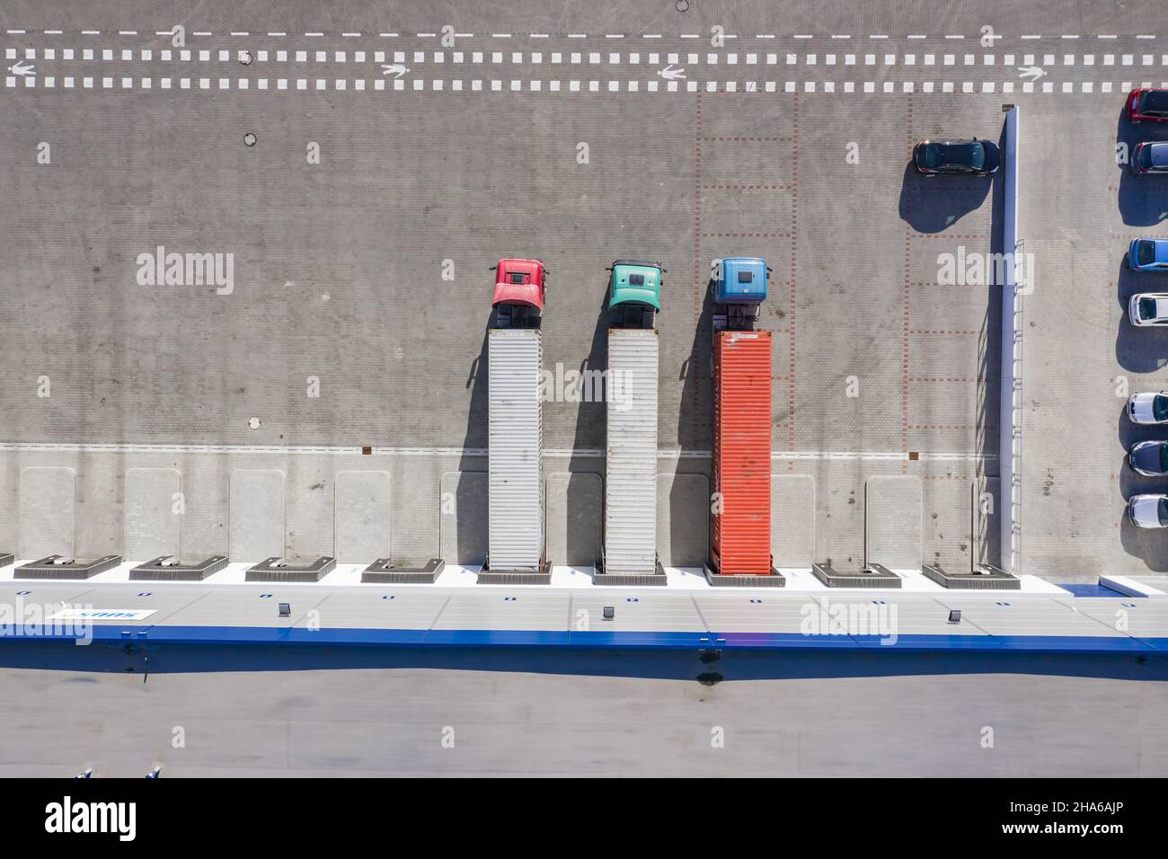 Aerial view of trucks unloading in logostics center Stock Photo - Alamy