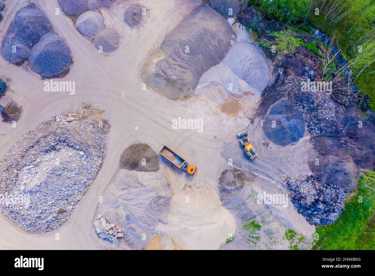 Aerial view of sandpit and factory plant producing sand materials for ...