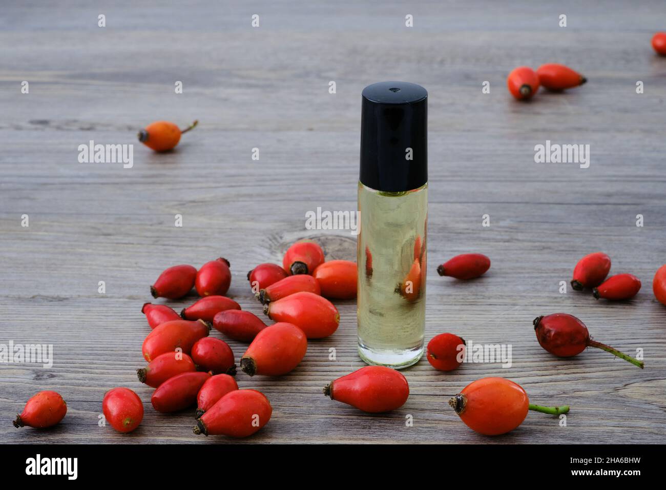 Dog rose (Rosa Canina) red rosehip oil extract and natural red fruits ...