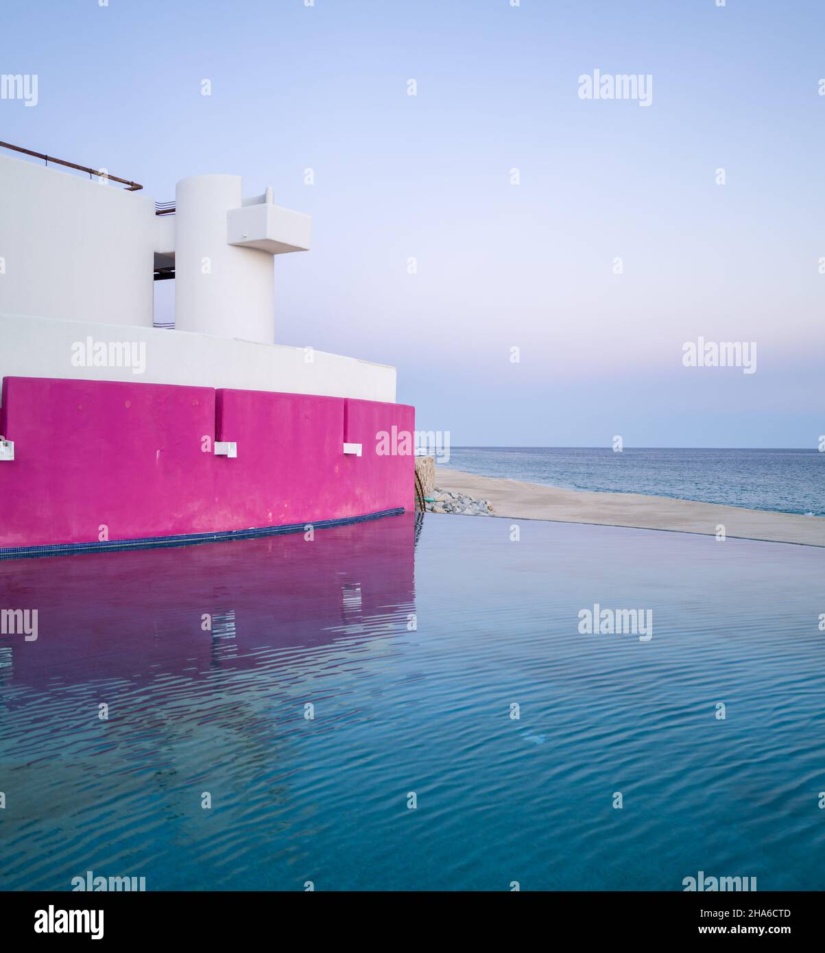 calm pool water reflected in the ocean beach sunset Stock Photo - Alamy