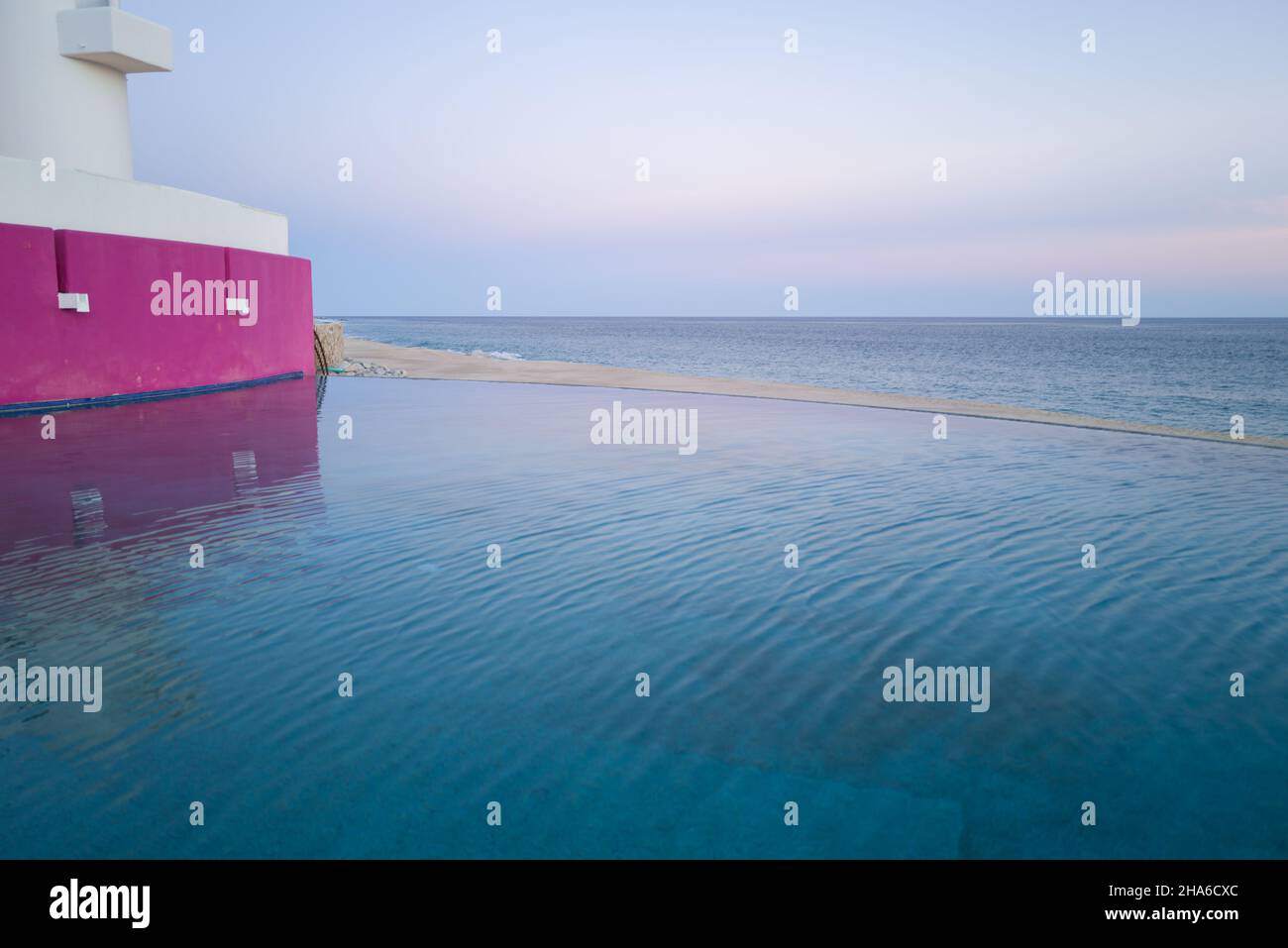calm pool water reflected in the ocean beach sunset Stock Photo - Alamy