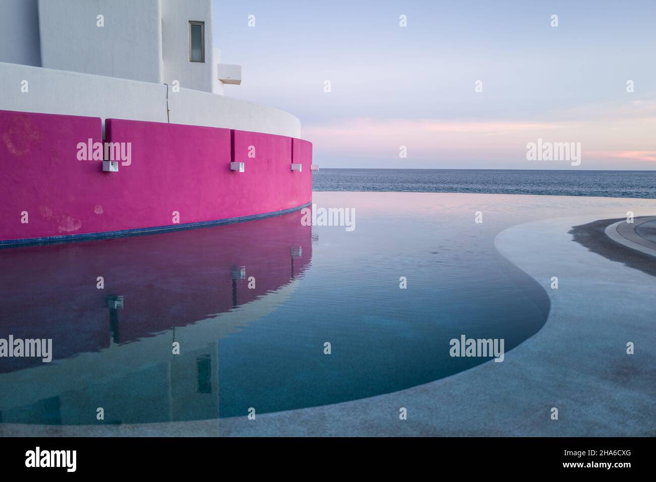 calm pool water reflected in the ocean beach sunset Stock Photo - Alamy