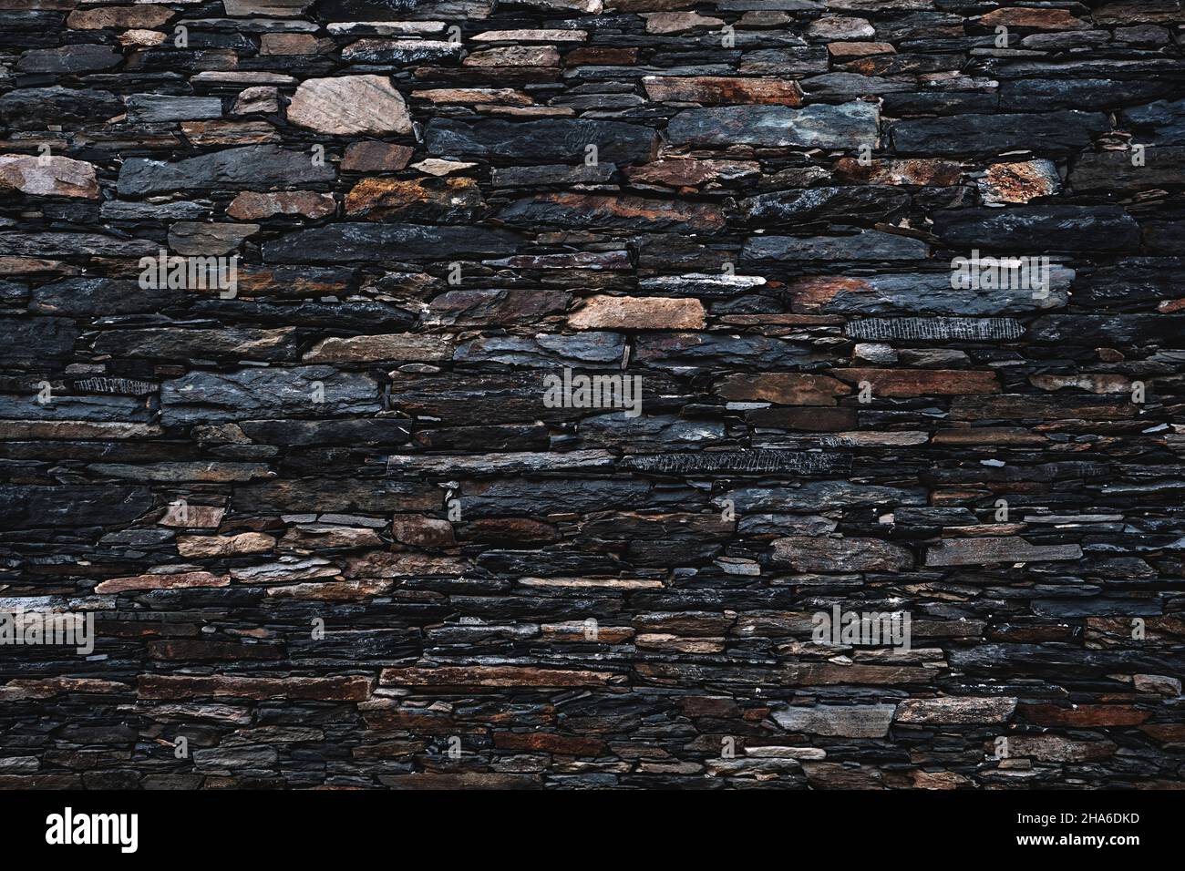Old rough slate stone wall, traditional construction in the Courel ...