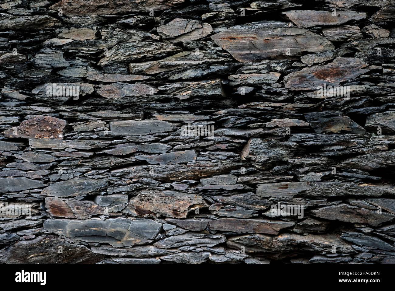 Old rough slate stone wall, traditional construction in the Courel ...