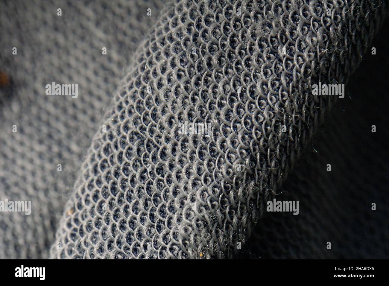 Big piece of fabric with interweaving circular strings on a blurred ...