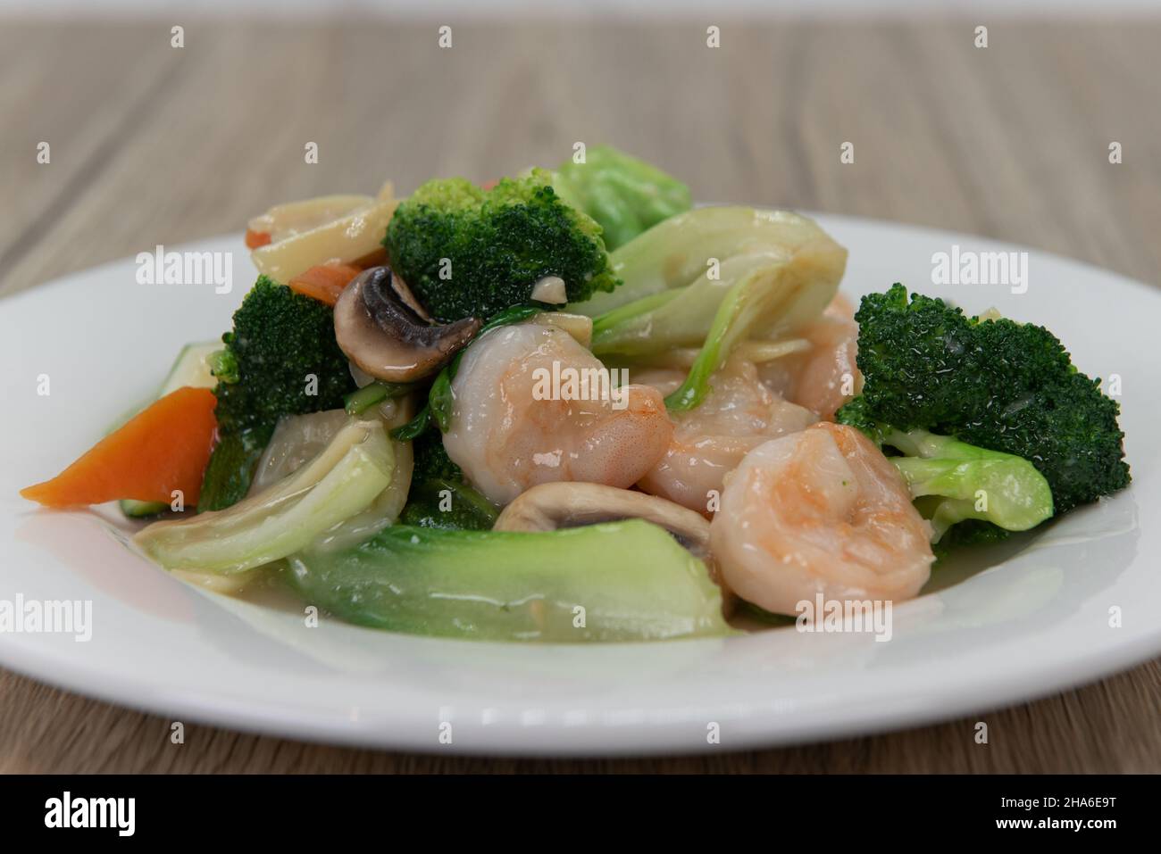 Shrimp and mixed vegetables swimming in a buttery sauce for some ...