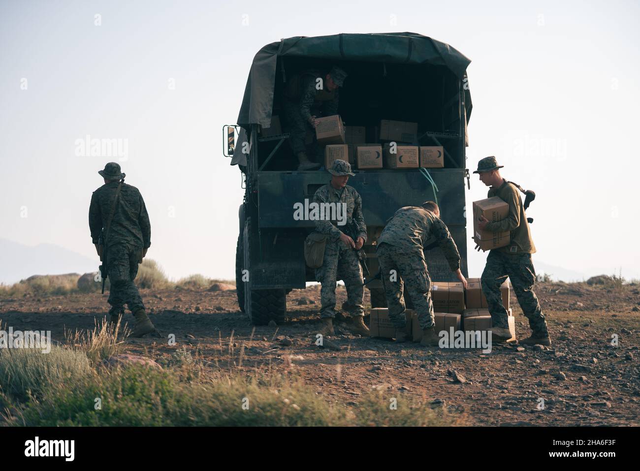 U.S. Marines of various commands unload cases of Meals Ready-to-Eat at ...