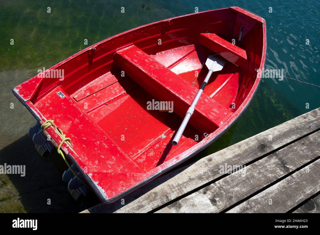 Red dingy alongside wharf, Boat Harbour, Wellington, North Island, New ...