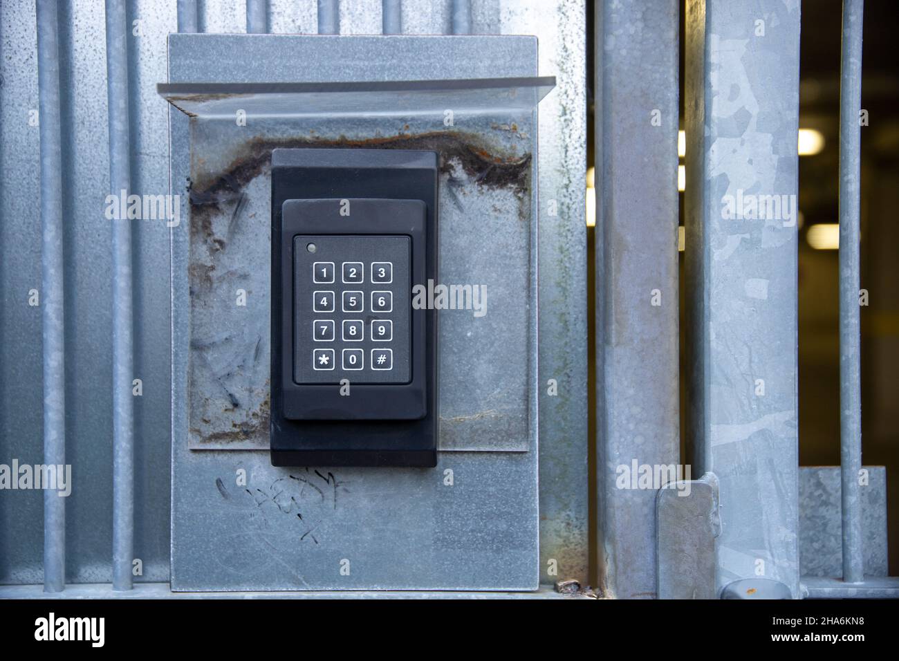 Closeup of a modern lock system with a passcode in front of an iron ...