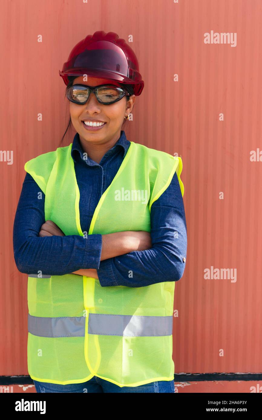 Portrait of a female Hispanic worker in a hard hat factory Stock Photo ...