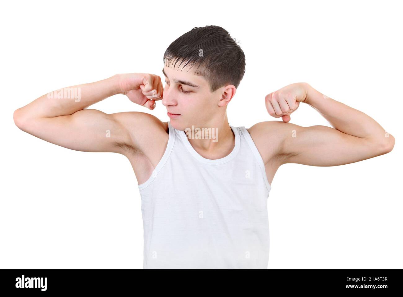 Handsome Teenager Muscle flexing Isolated on the White Background Stock ...