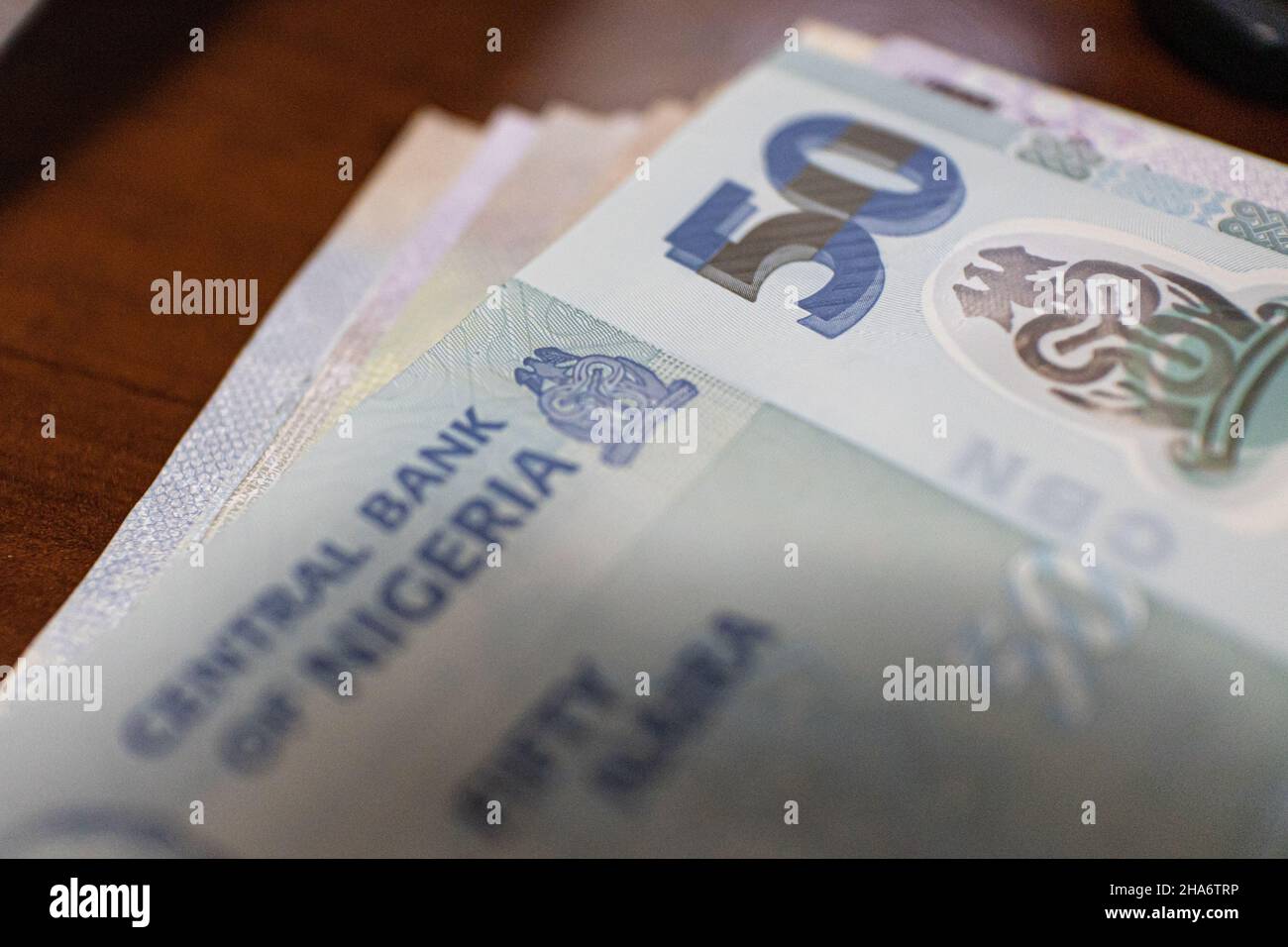 Nigerian 50 Naira note closeup in bank Stock Photo - Alamy