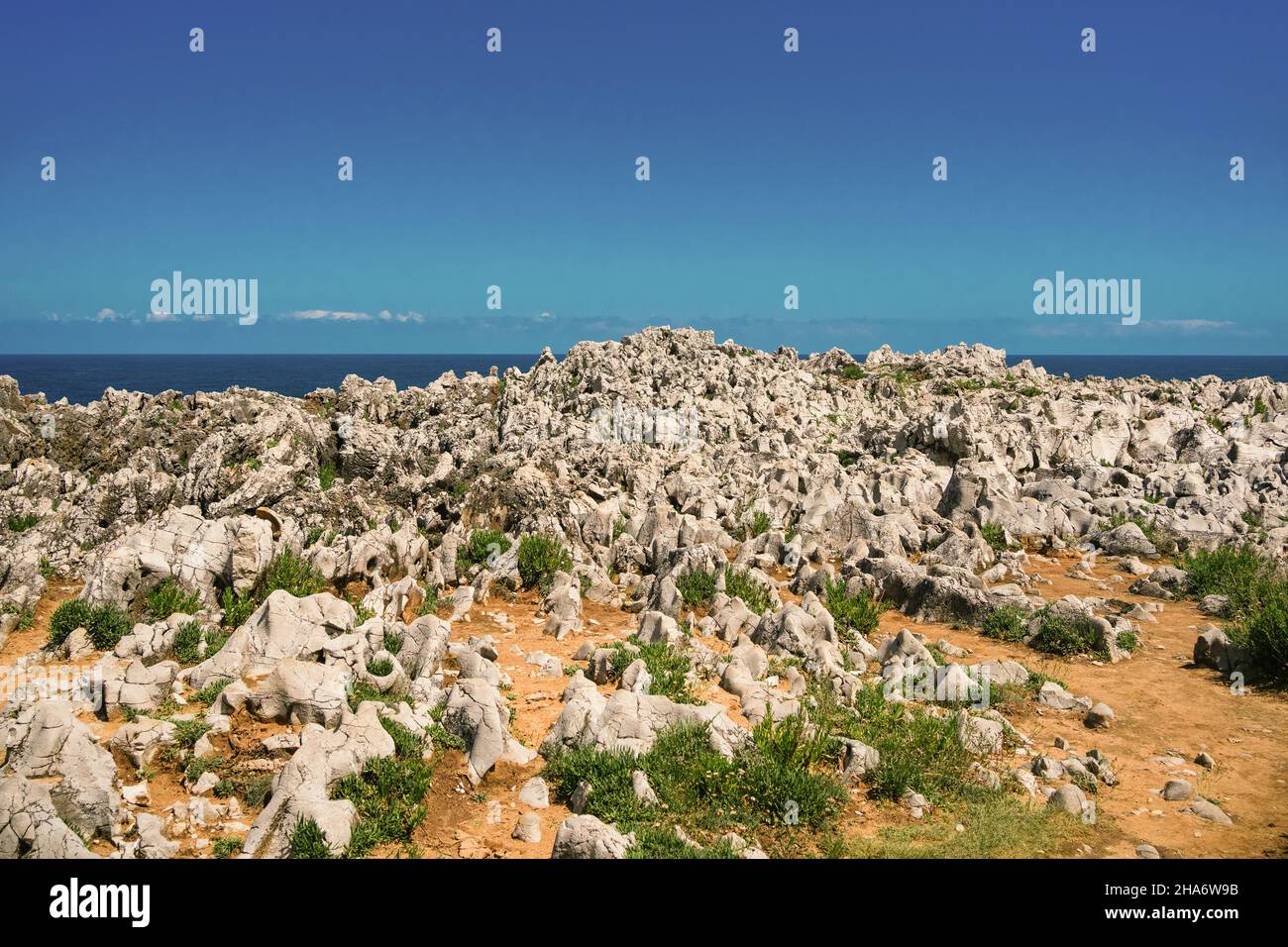 Rock formations and pebbles. Wave texture, a rock formation in the sea ...